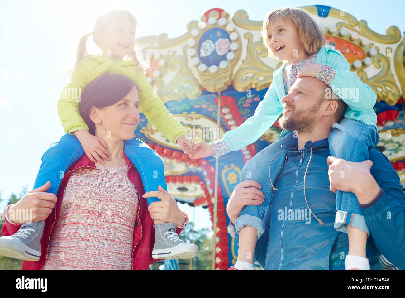 Family in amusement park Stock Photo - Alamy