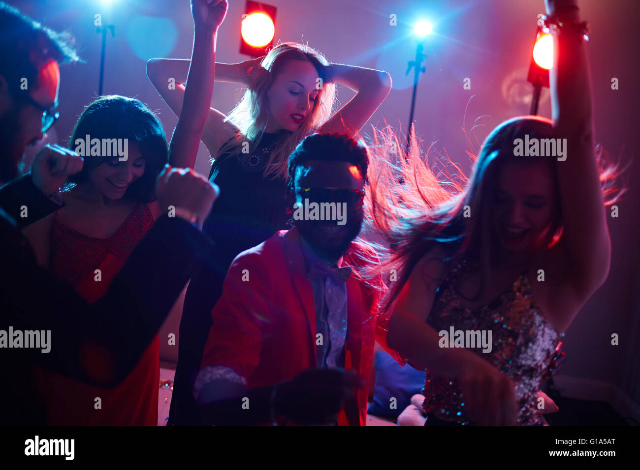 Multi-ethnic dancers enjoying party in night club Stock Photo - Alamy