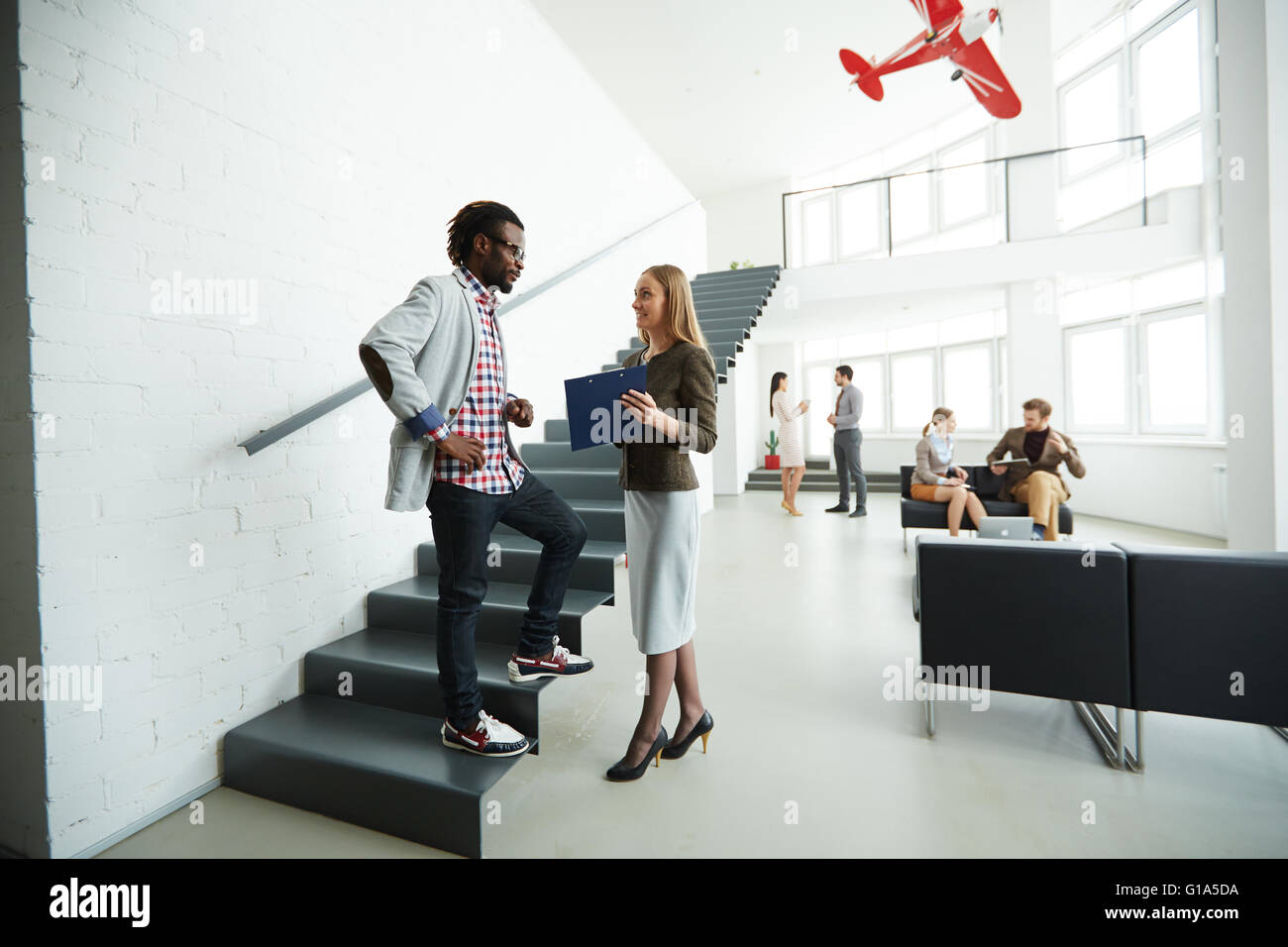 Business colleagues meeting on stairs hi-res stock photography and ...