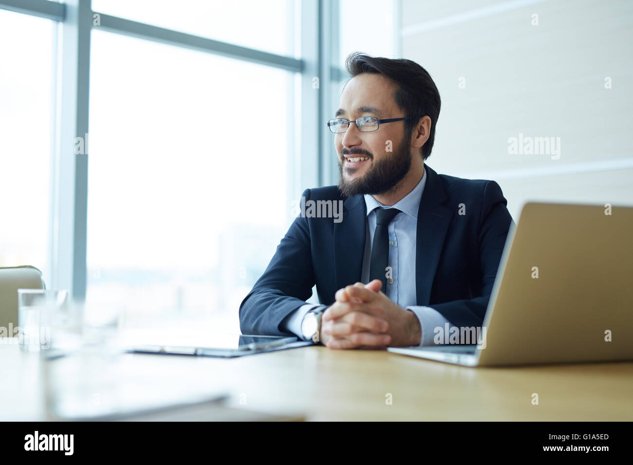 Happy asian businessman sitting hi-res stock photography and images - Alamy