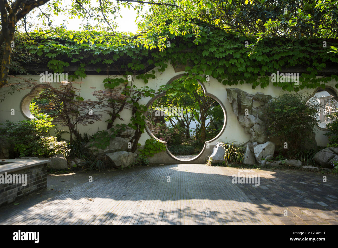 Chinese garden with a round gate on the Purple mountain park in Nanjing ...