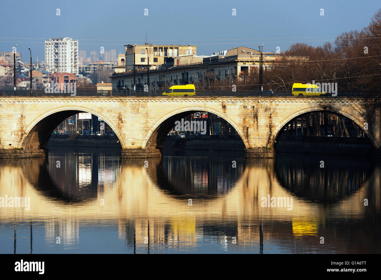 Eurasia, Caucasus region, Georgia, Tbilisi, arched bridge reflecting in ...