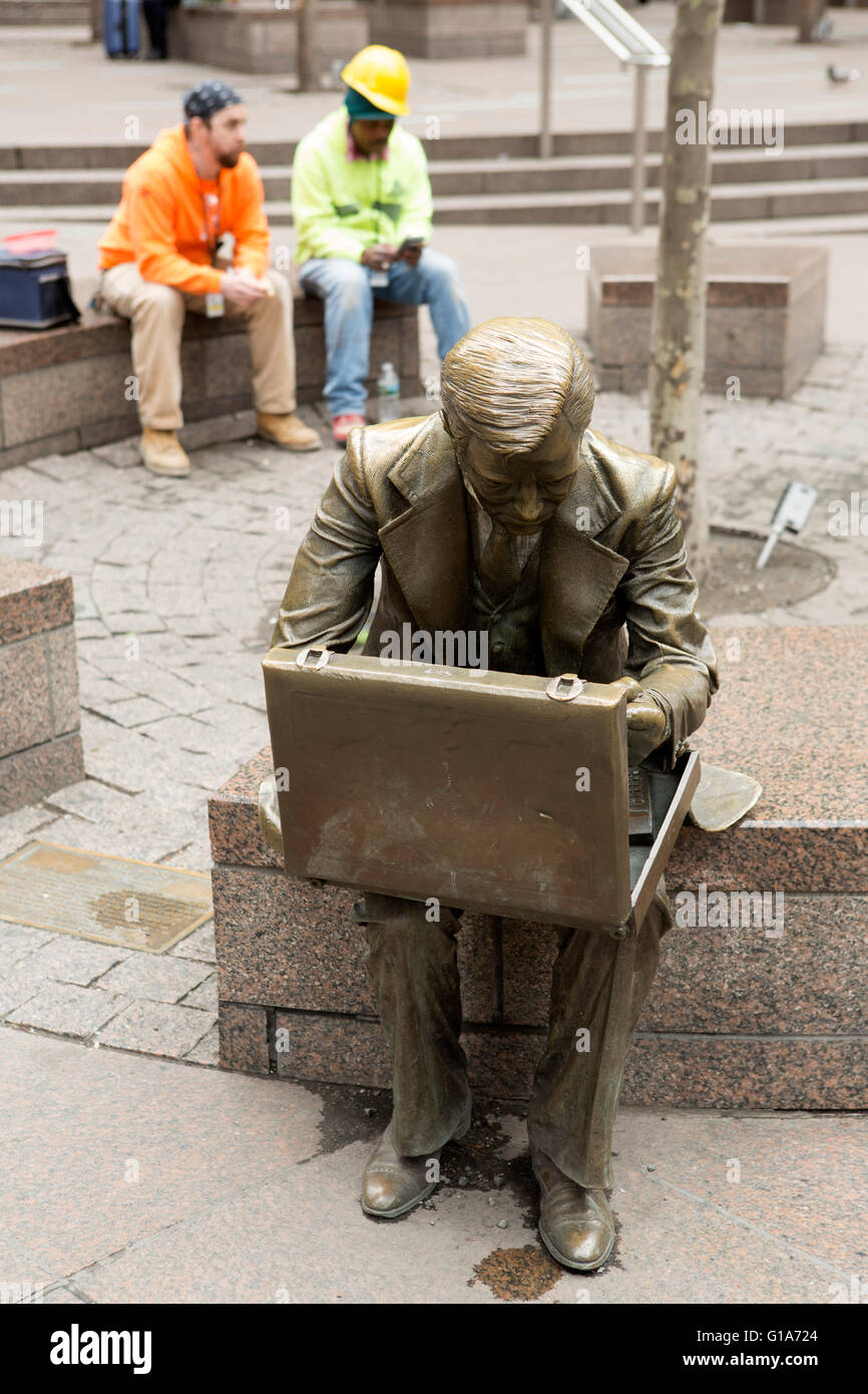 Bronze memorial depicting an office worker in New York City, USA. Two ...