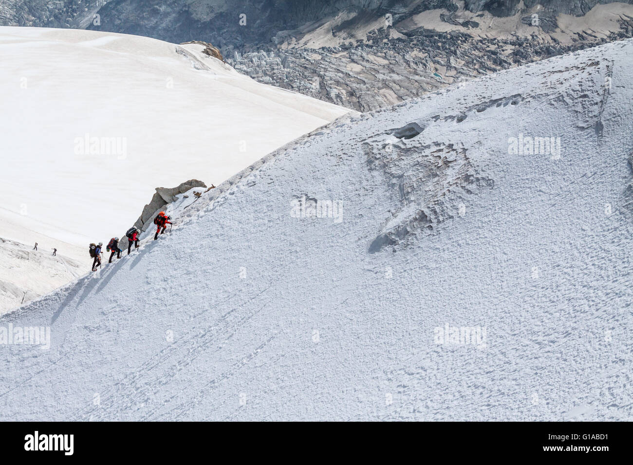 Group of climbers climbing on the top of Mount Blanc in France ...