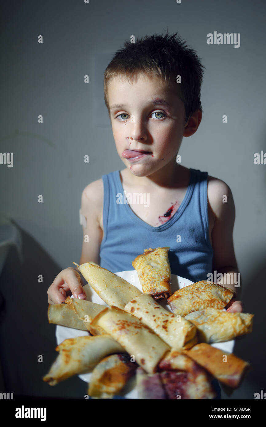 child boy offering a plate with pancakes with jam Stock Photo - Alamy