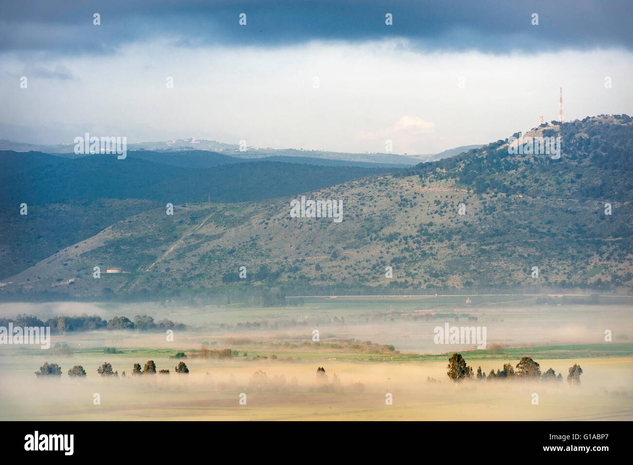 Fog in the Hula Valley of Israel. The distant hills of Lebanon can be ...