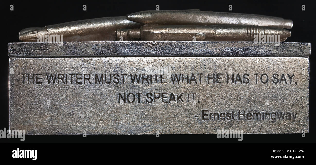 Metal pen and pencil box with hemingway quote Stock Photo - Alamy