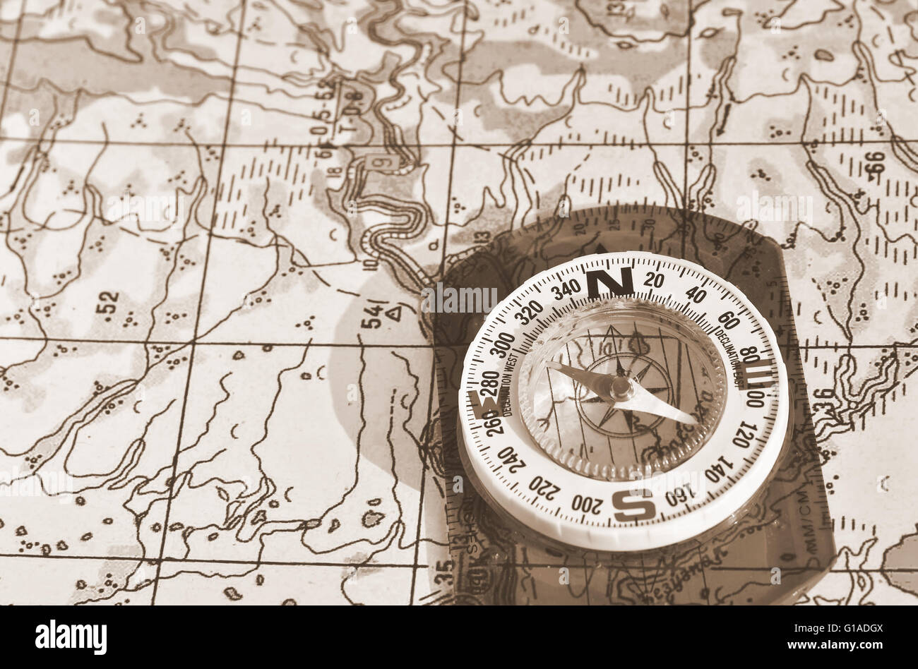 Tools for the journey - a map and a compass. Magnetic compass is ...