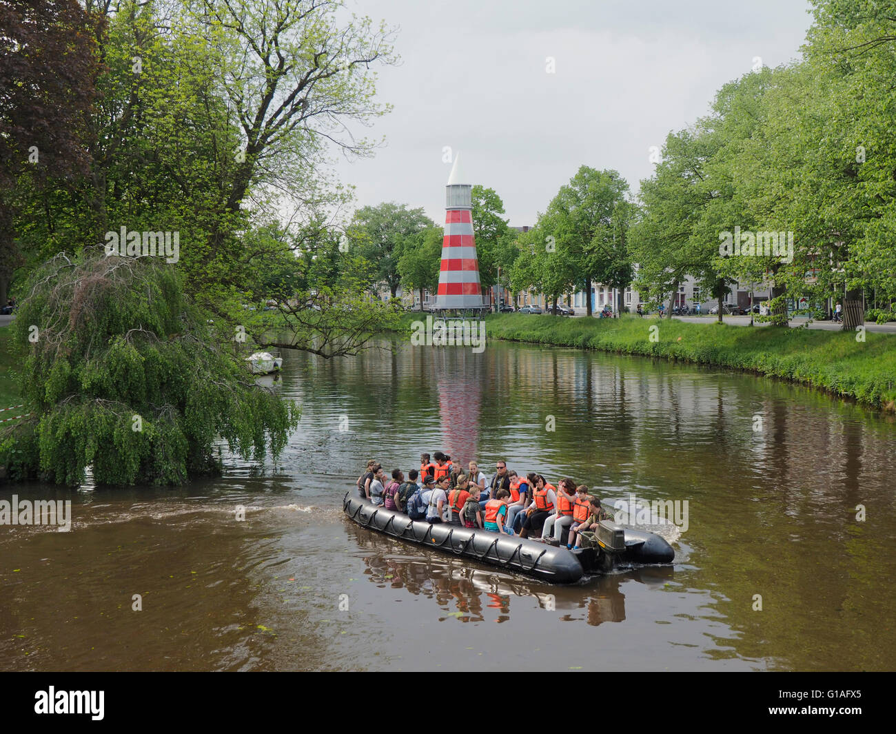 People having a ride in a military inflatable boat, Valkenberg park ...