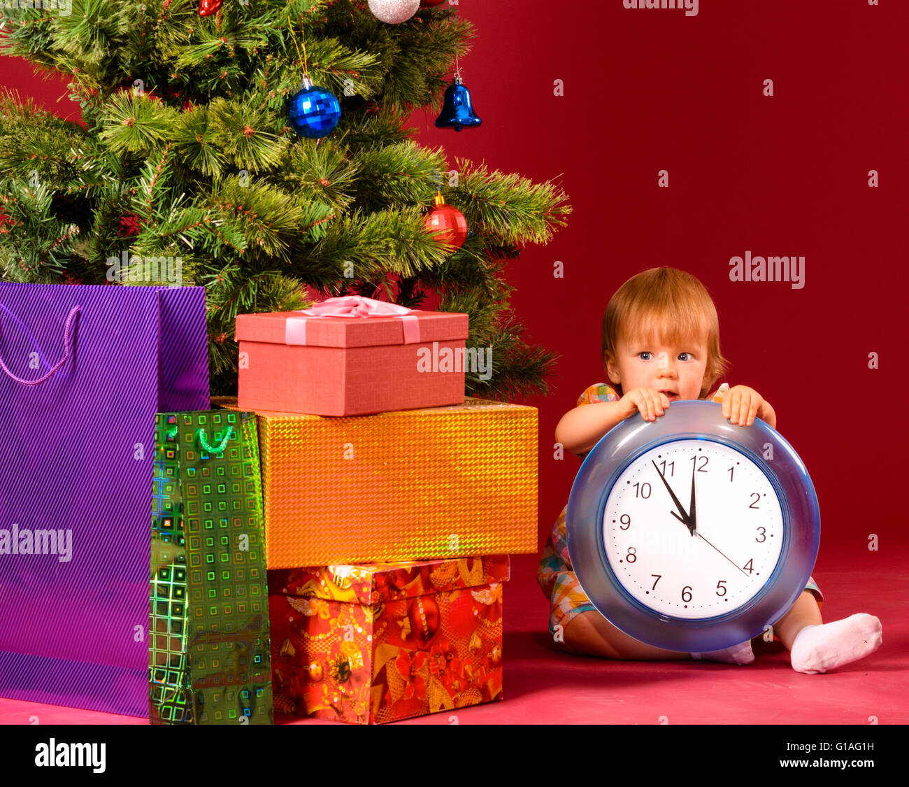 baby with clock Stock Photo - Alamy