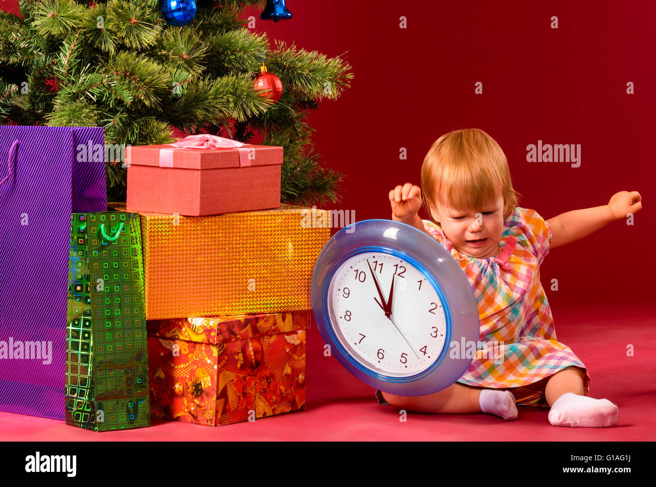 baby with clock Stock Photo - Alamy