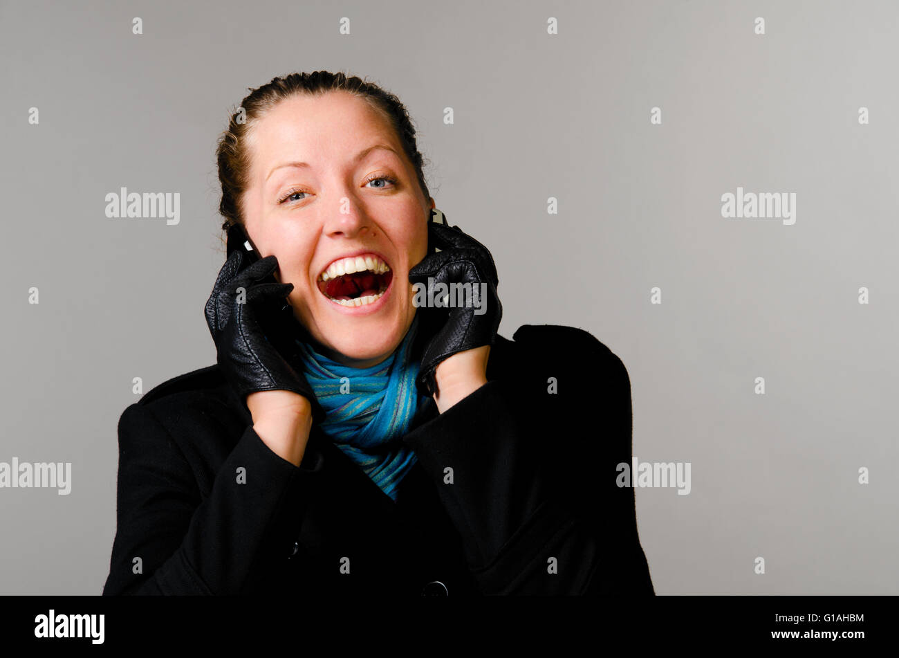 woman with two mobile phones Stock Photo - Alamy