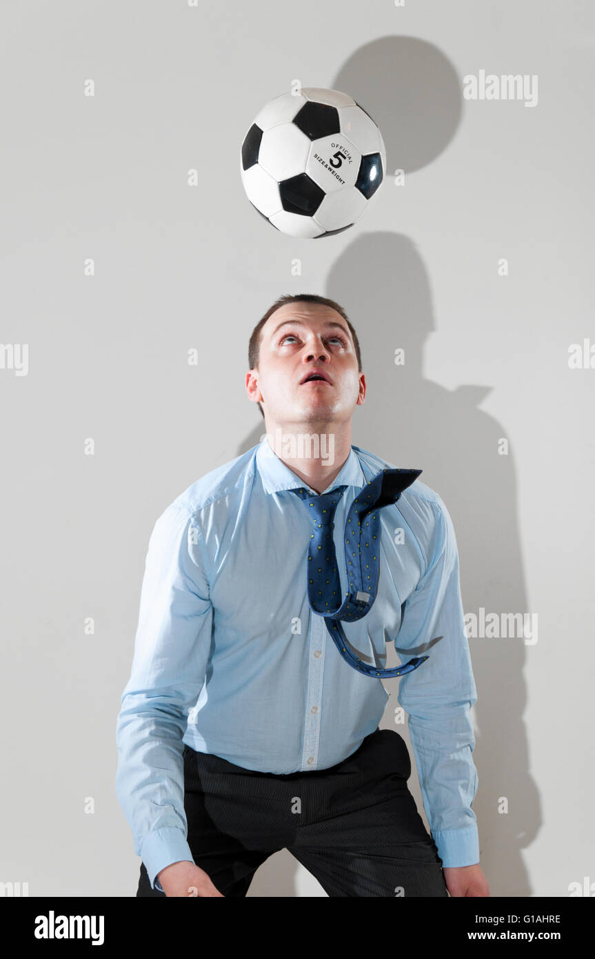 playing football at office Stock Photo - Alamy
