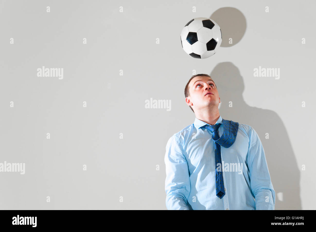 playing football at office Stock Photo - Alamy
