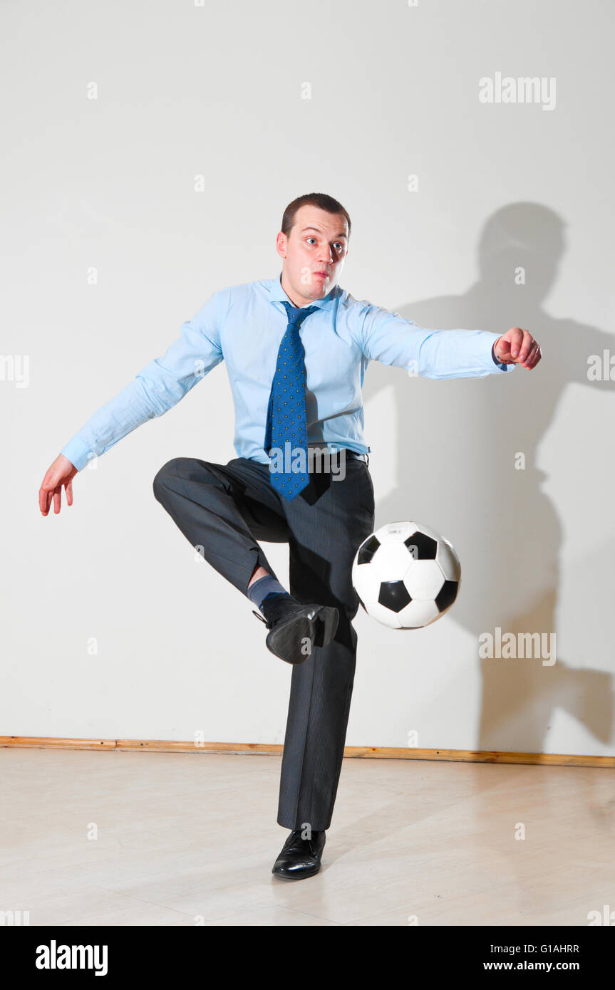 playing football at office Stock Photo - Alamy