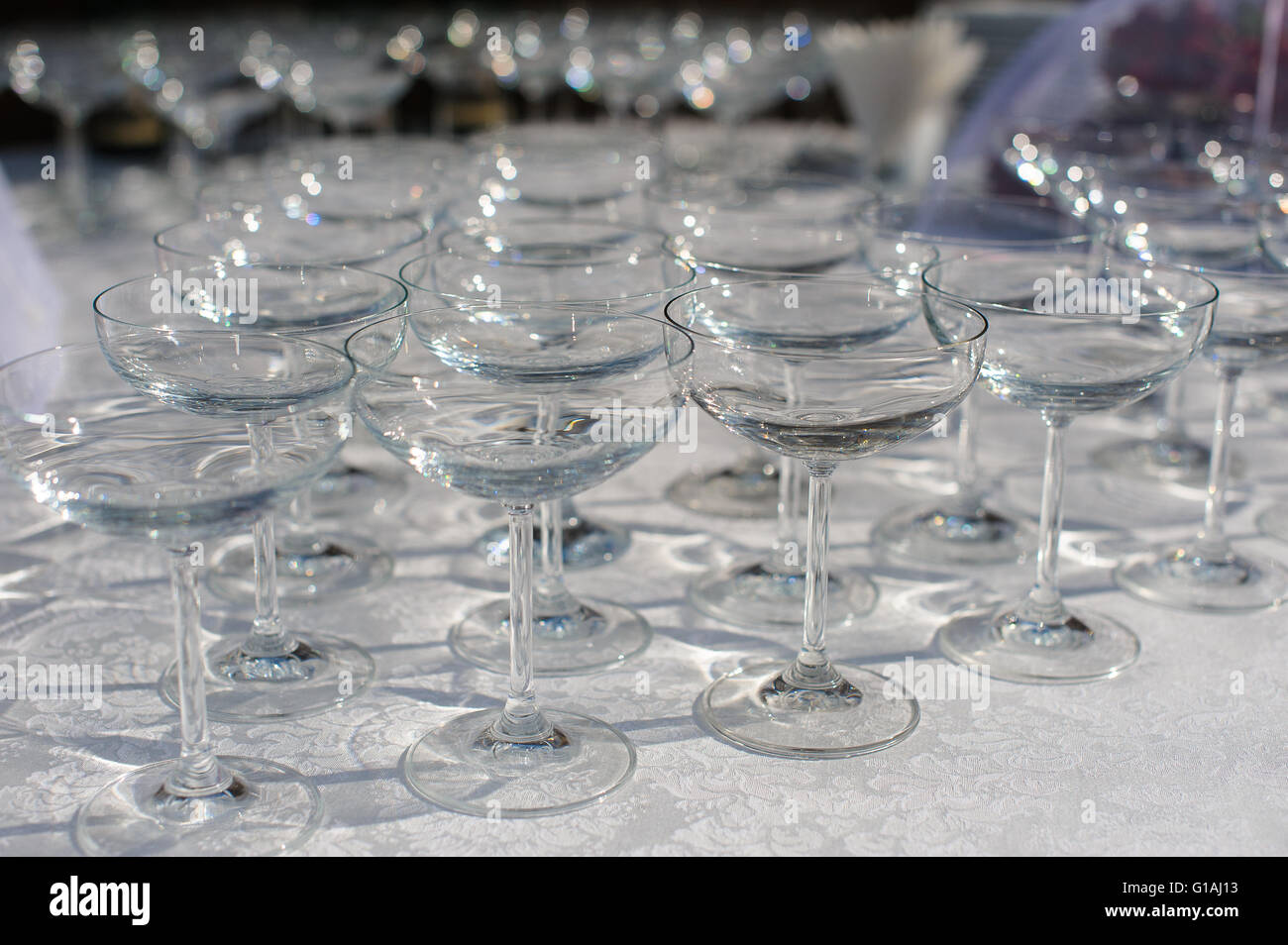 Empty cocktail glasses, martini on the table. White tablecloth Stock ...