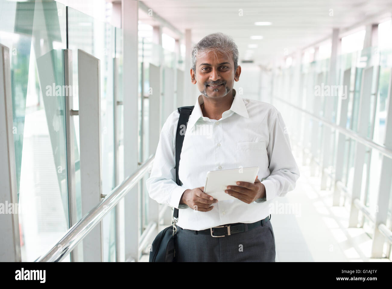 indian businessman outdoor with a computer tablet Stock Photo - Alamy