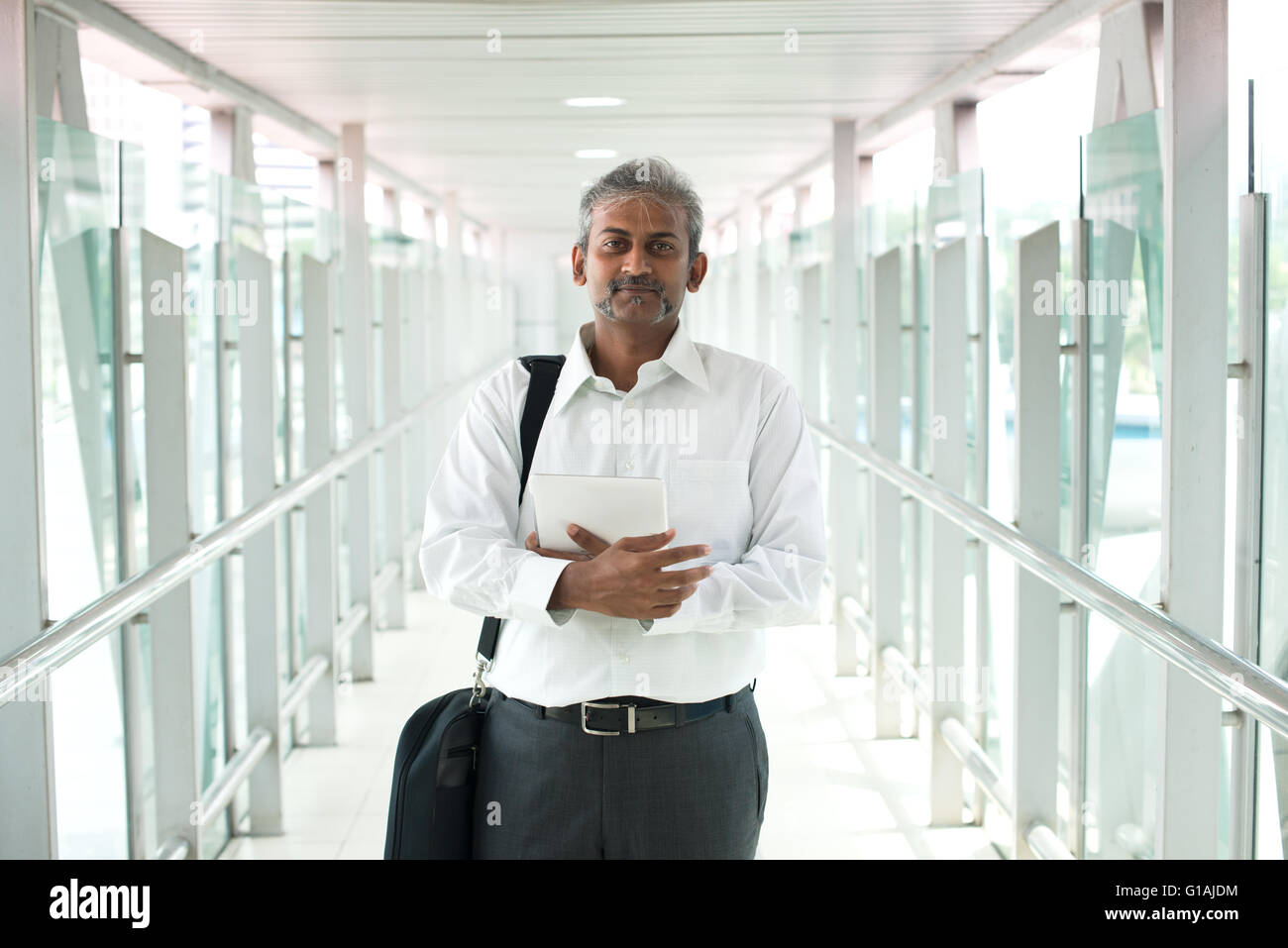 indian businessman outdoor with a computer tablet Stock Photo - Alamy