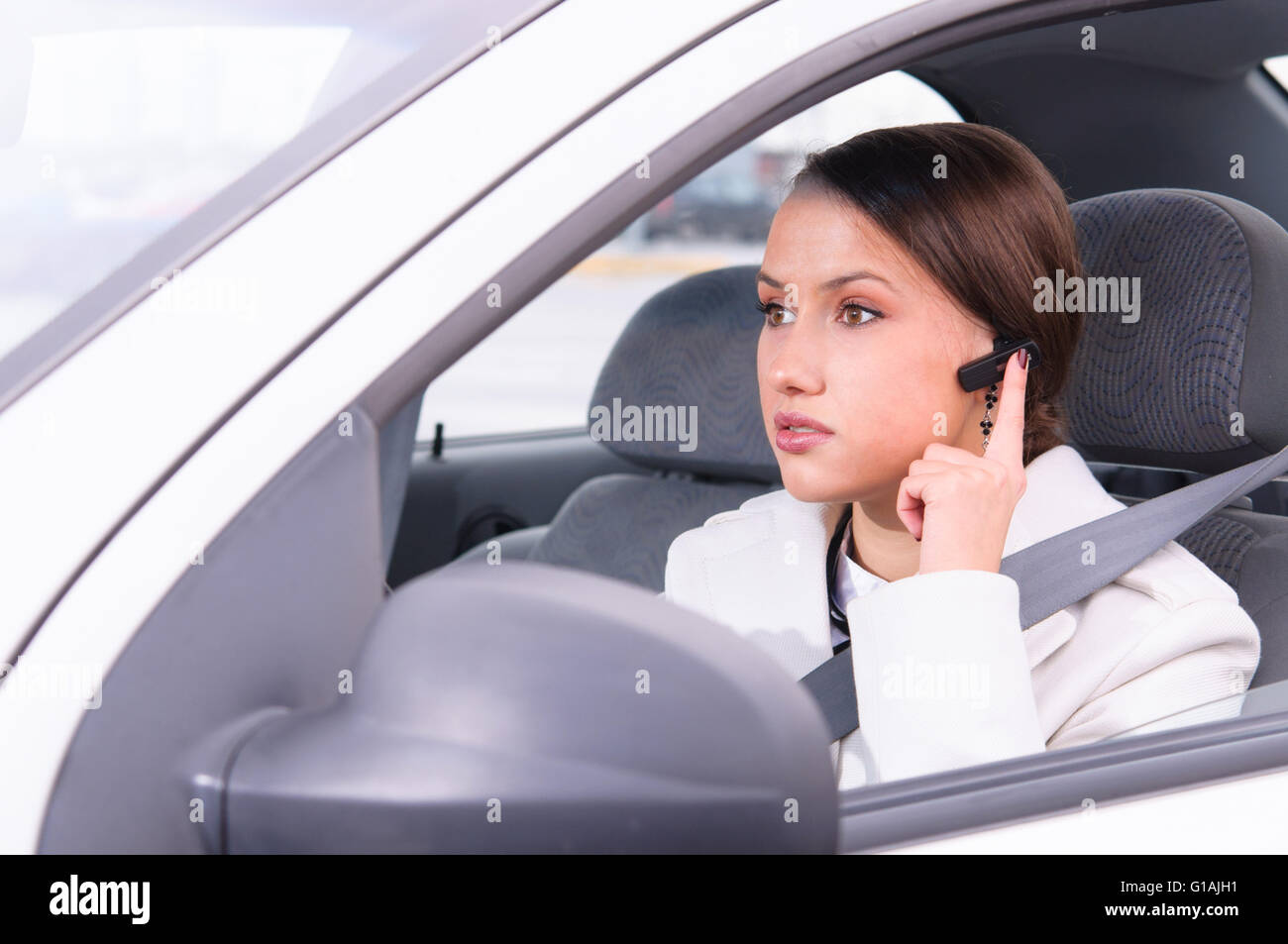 talking phone in a car using headset Stock Photo - Alamy