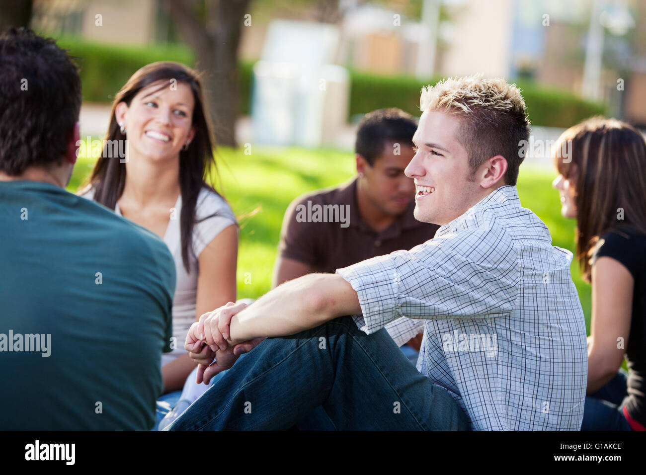 A multi-ethnic group of college students hanging around campus Stock ...