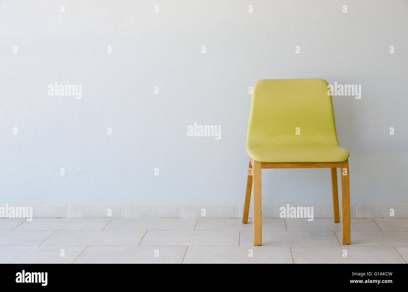 Wooden chair against wall hi-res stock photography and images - Alamy
