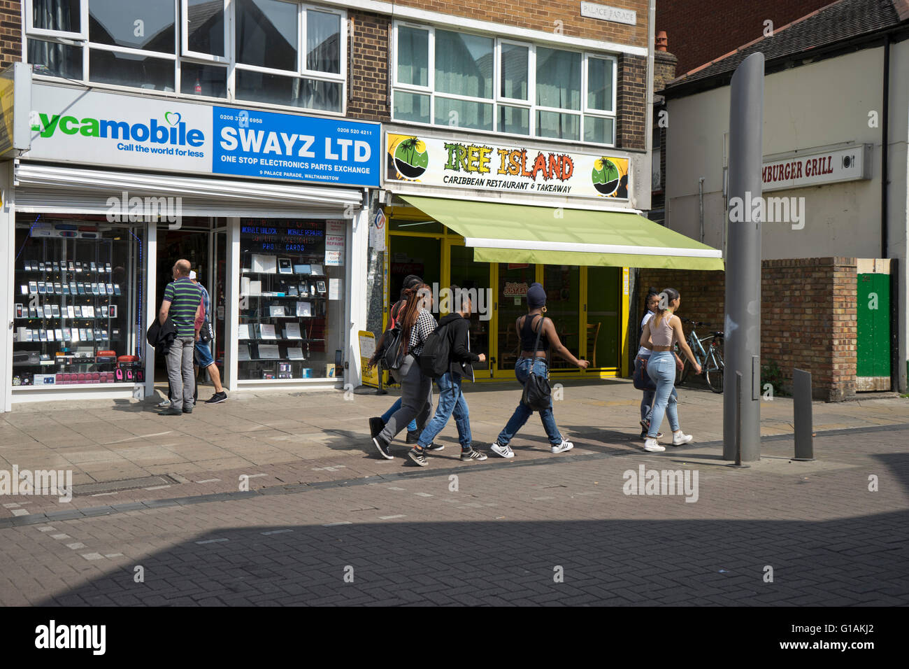 People walking in a pedestrianized street in multicultural Walthamstow ...