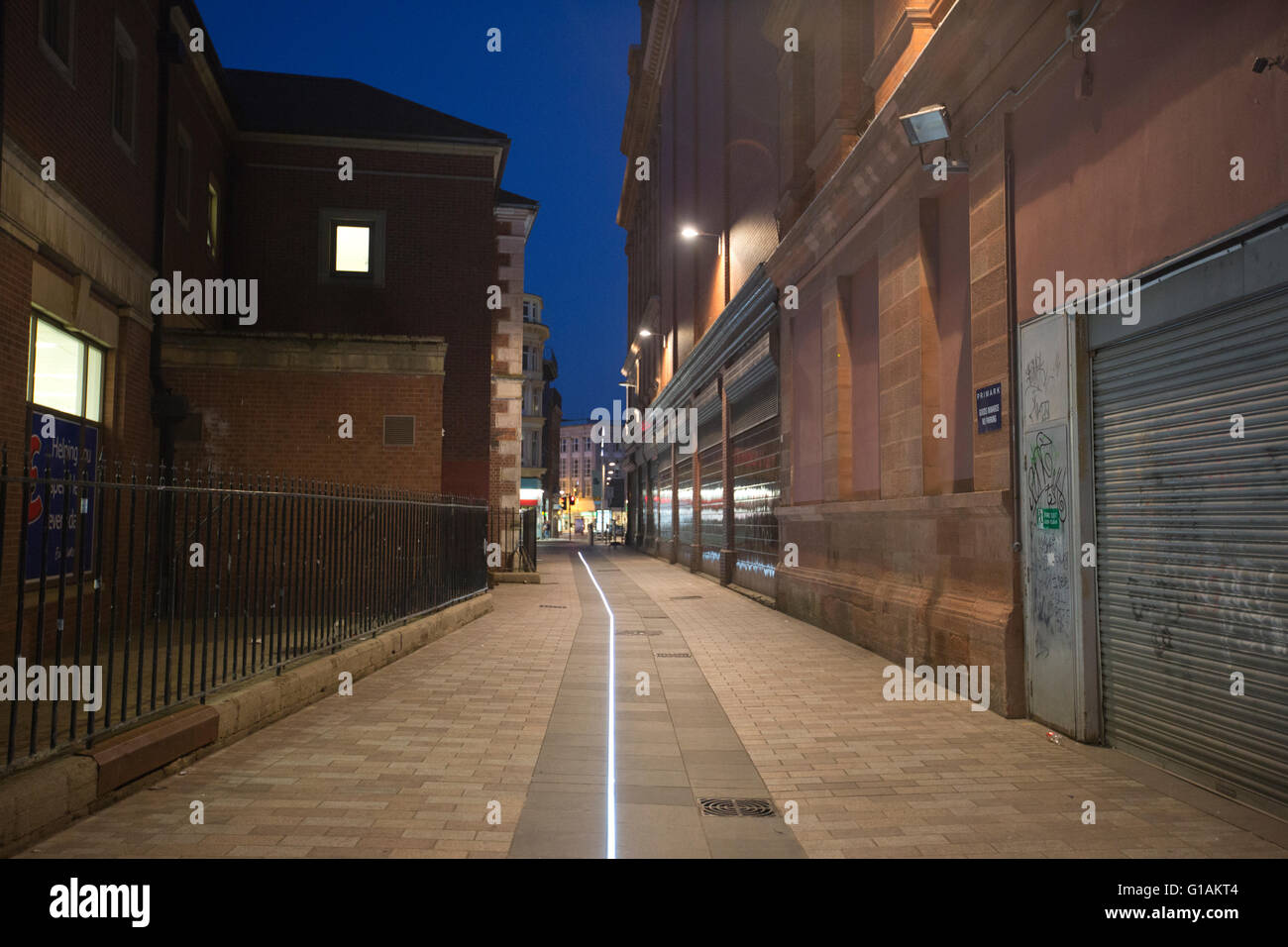 Illuminated light line, dividing the street path in Central Belfast at ...