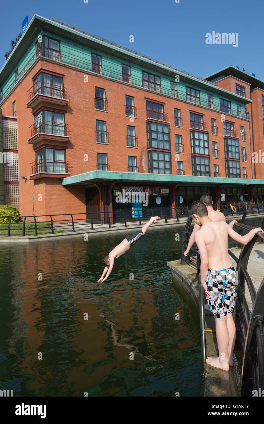 Local kids play in the water feature at Gasworks Path, Gasworks site ...