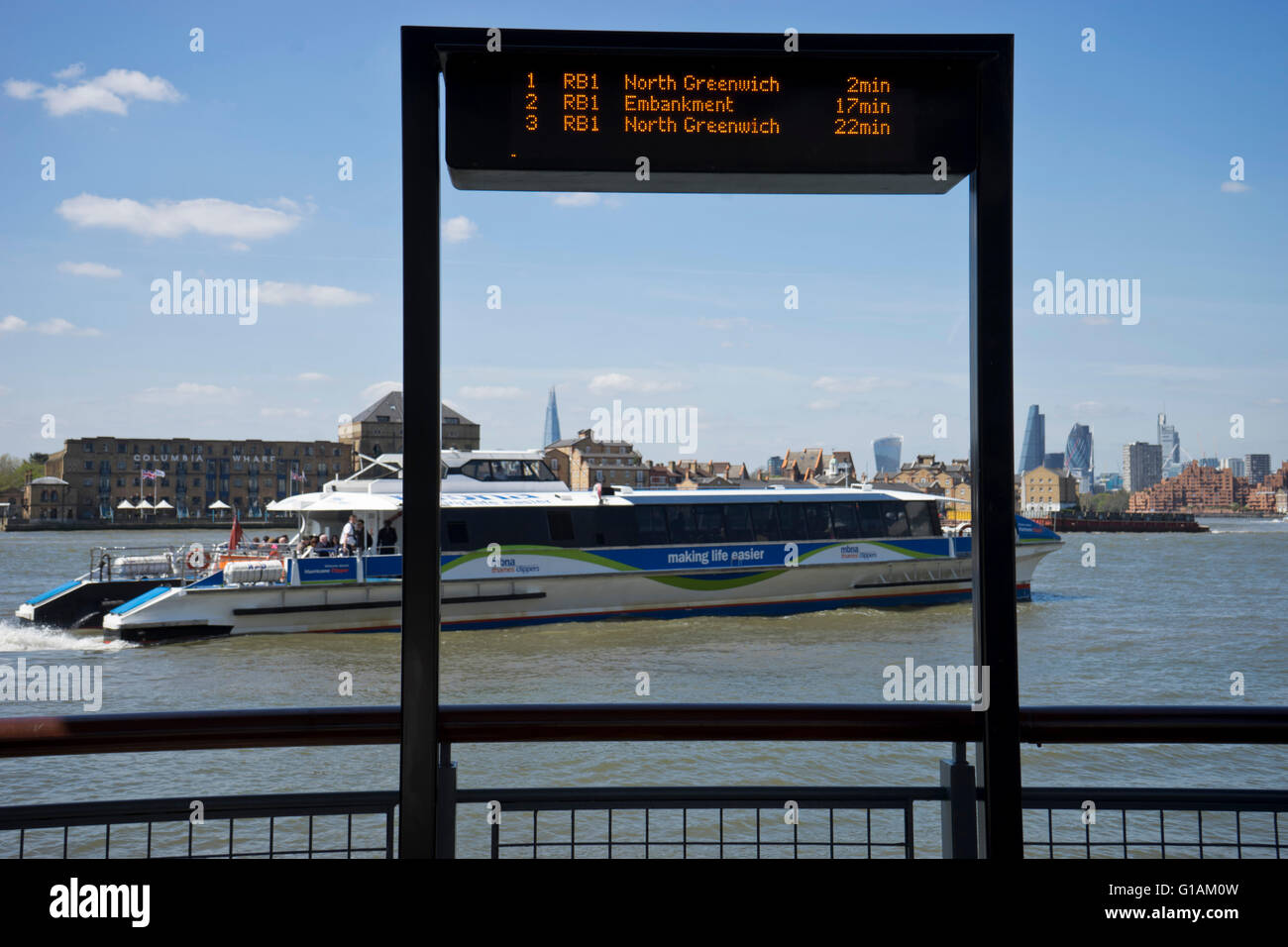 River Thames passenger ferry services by Canary Wharf. London, UK Stock ...