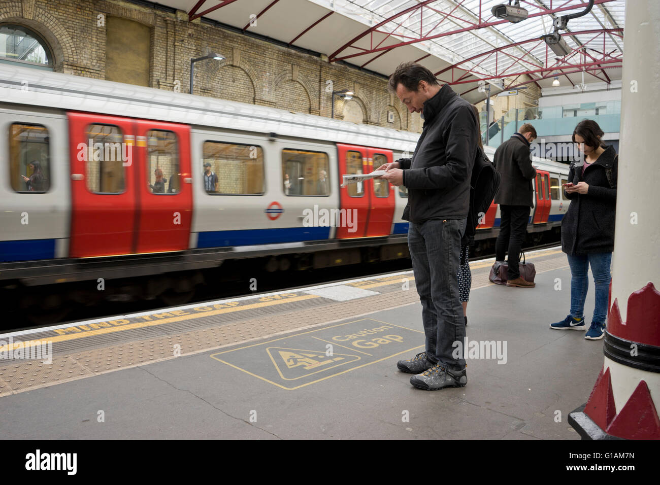 Commuters in an underground tube station in London, UK Stock Photo - Alamy
