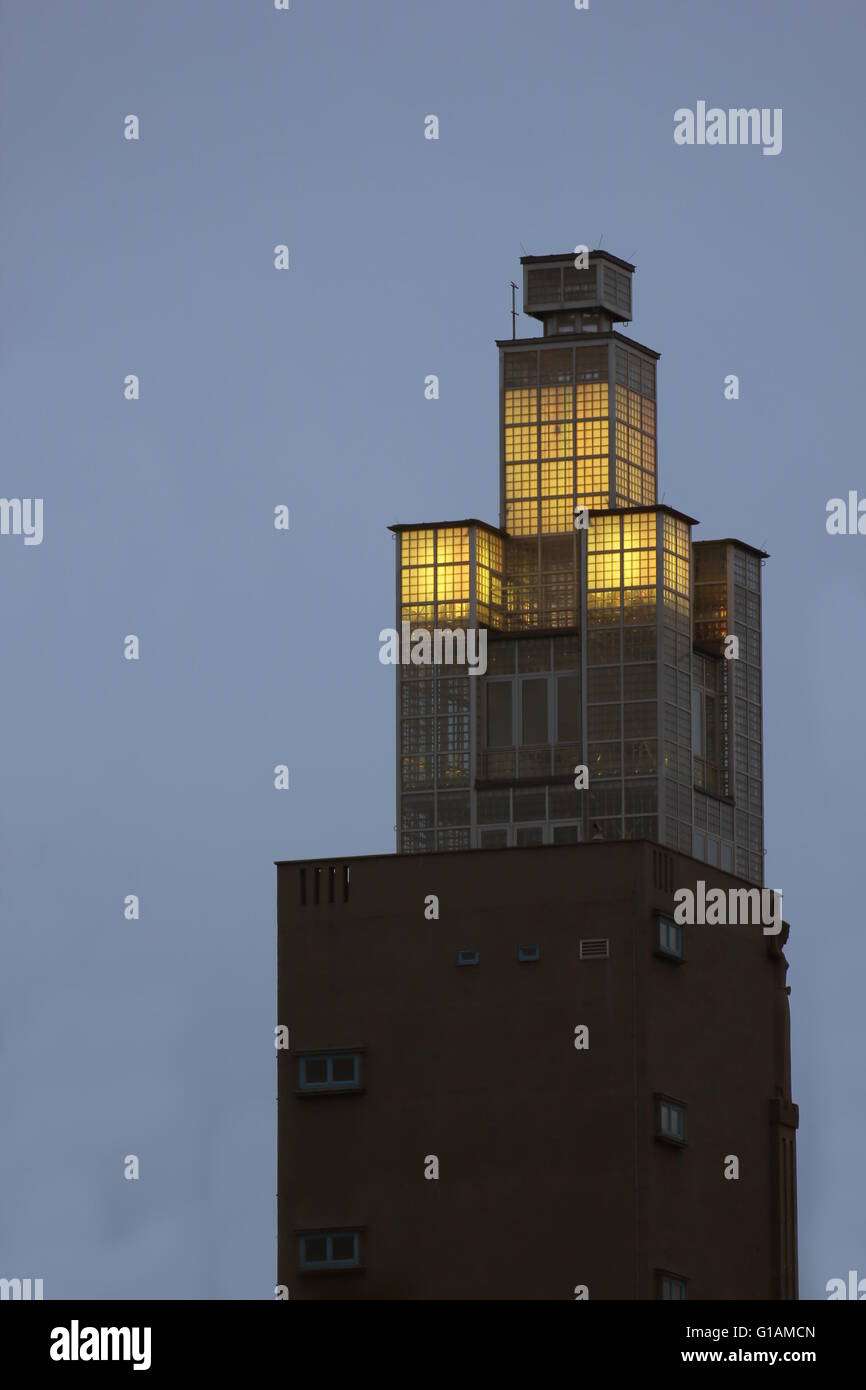Look-out tower in the evening with light in the glass section at the ...