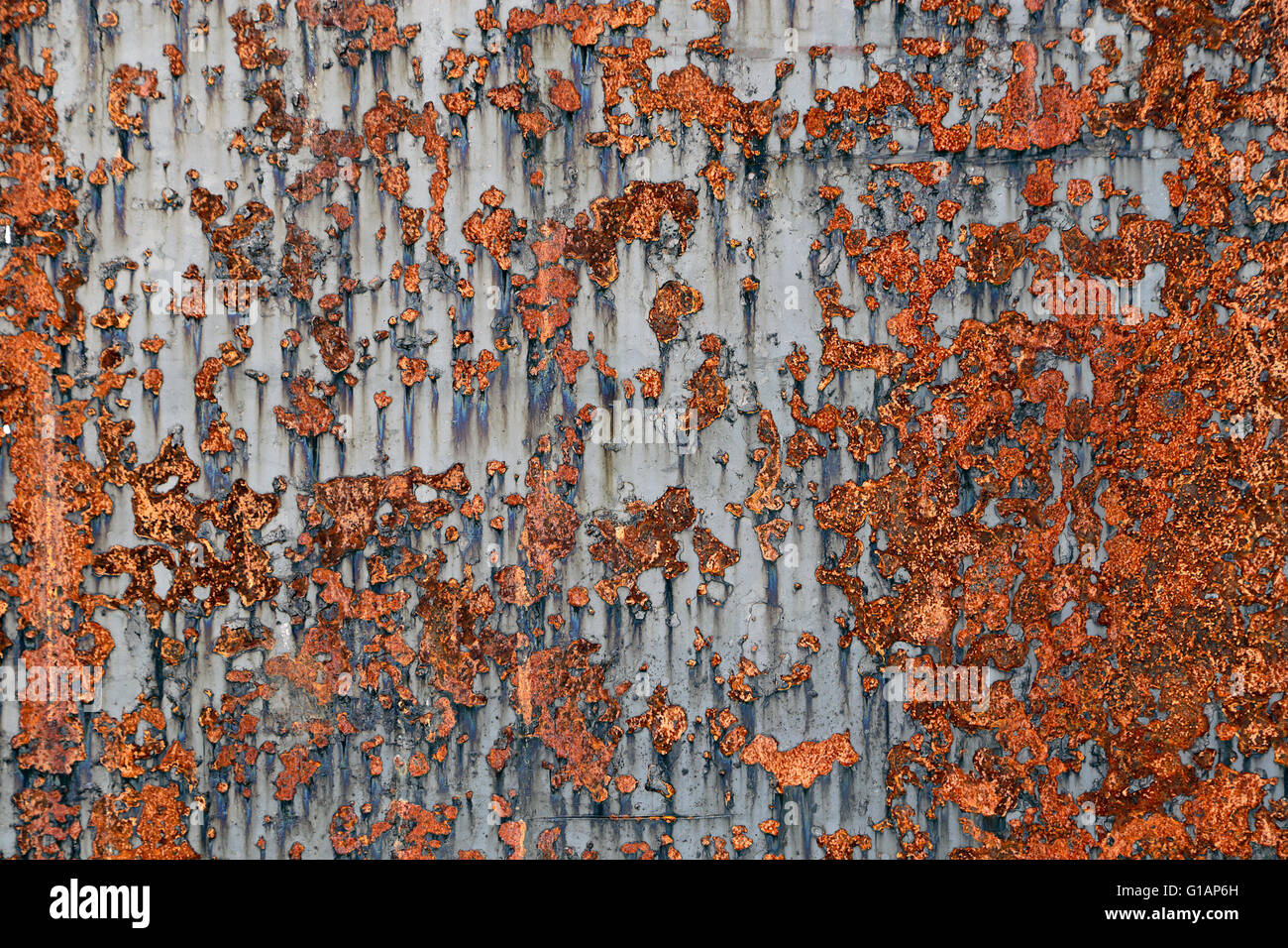 Rust structure on painted steel wall Stock Photo - Alamy