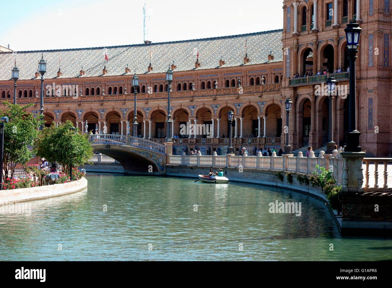 Tourists in rowing boat in front of Plaza de Espana Seville Stock Photo ...
