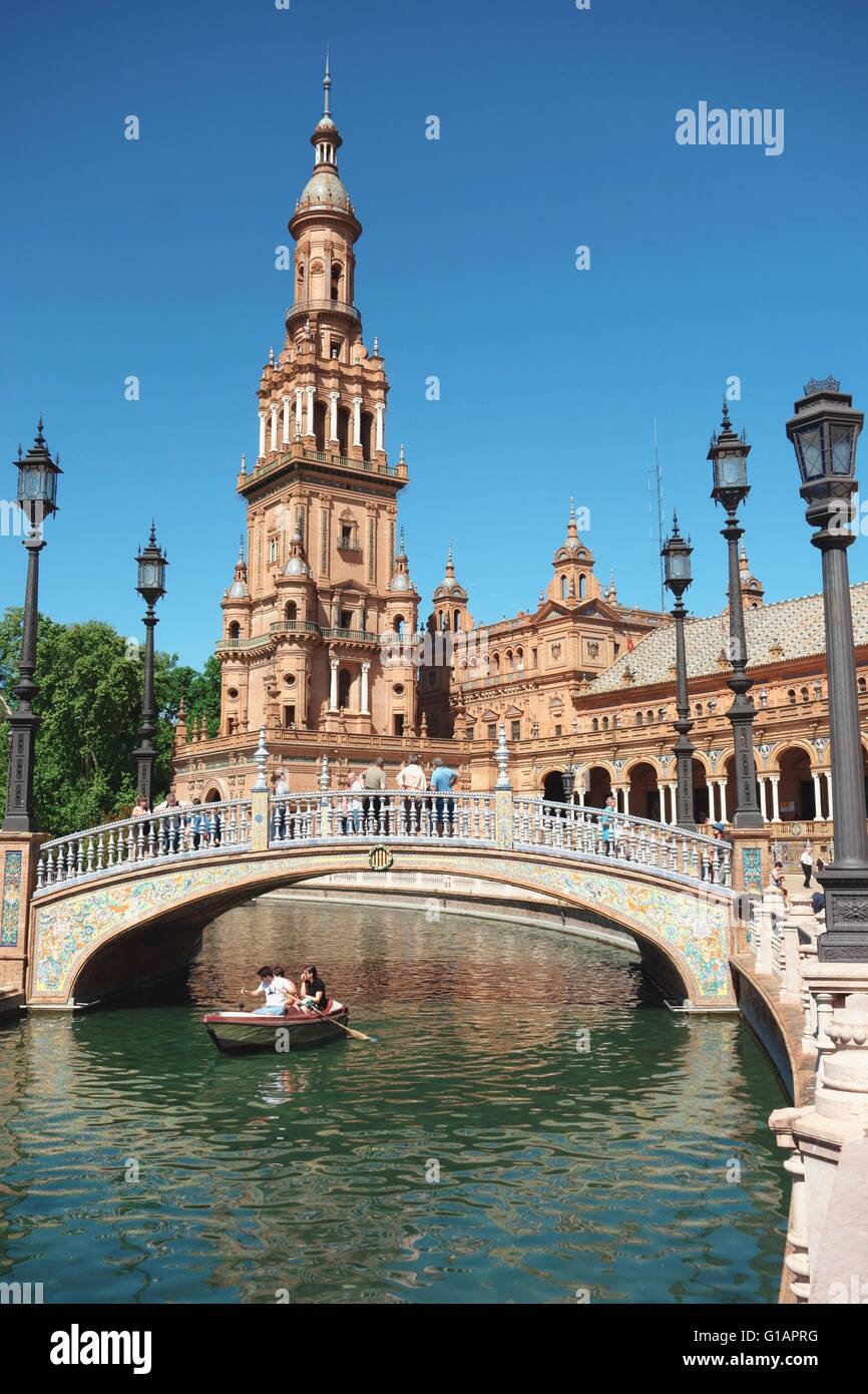 Rowing boat in front of ornate bridge Plaza de Espana Seville Stock ...