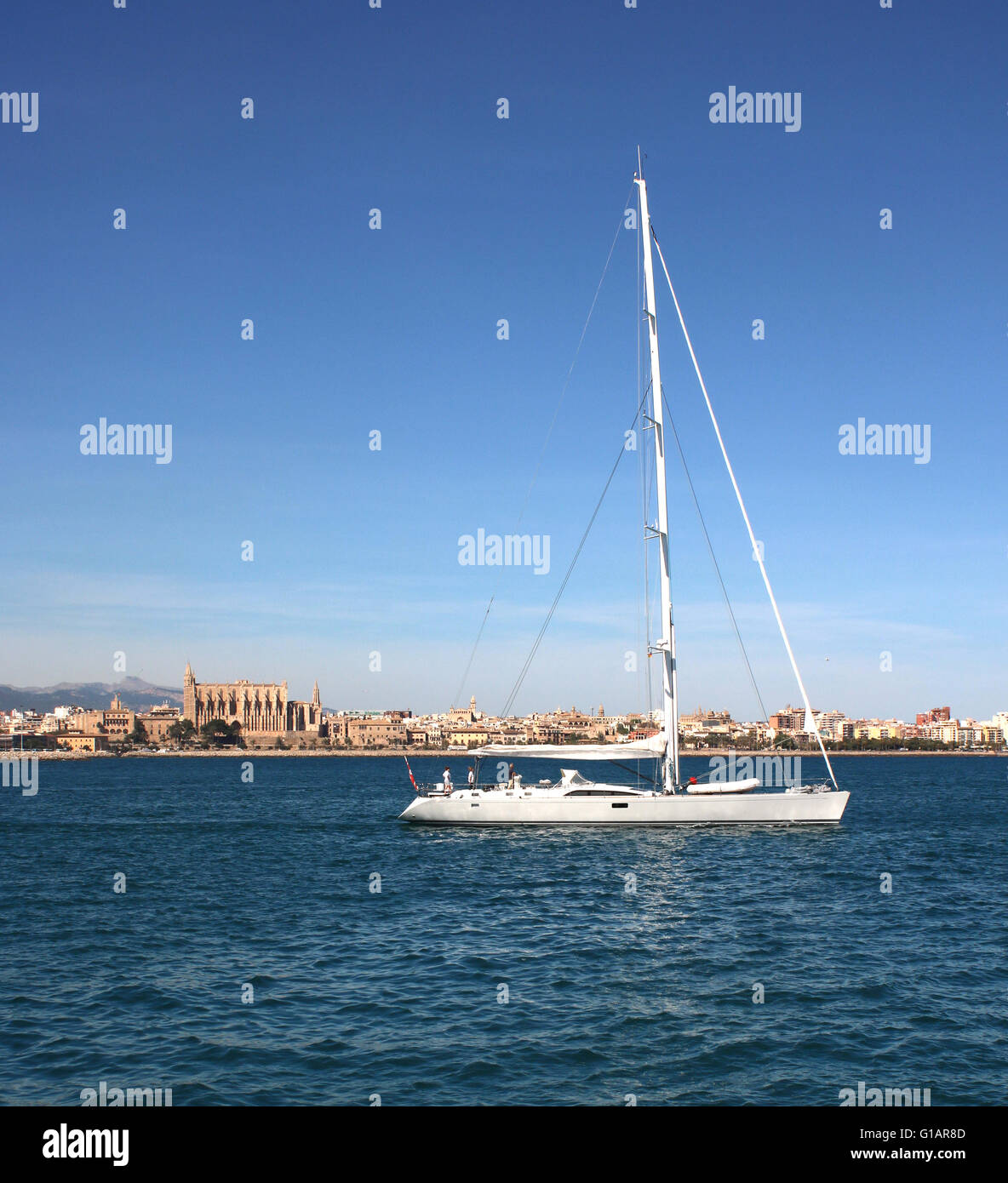 Sailing Yacht sailing out past the historic Palma Gothic Cathedral from ...