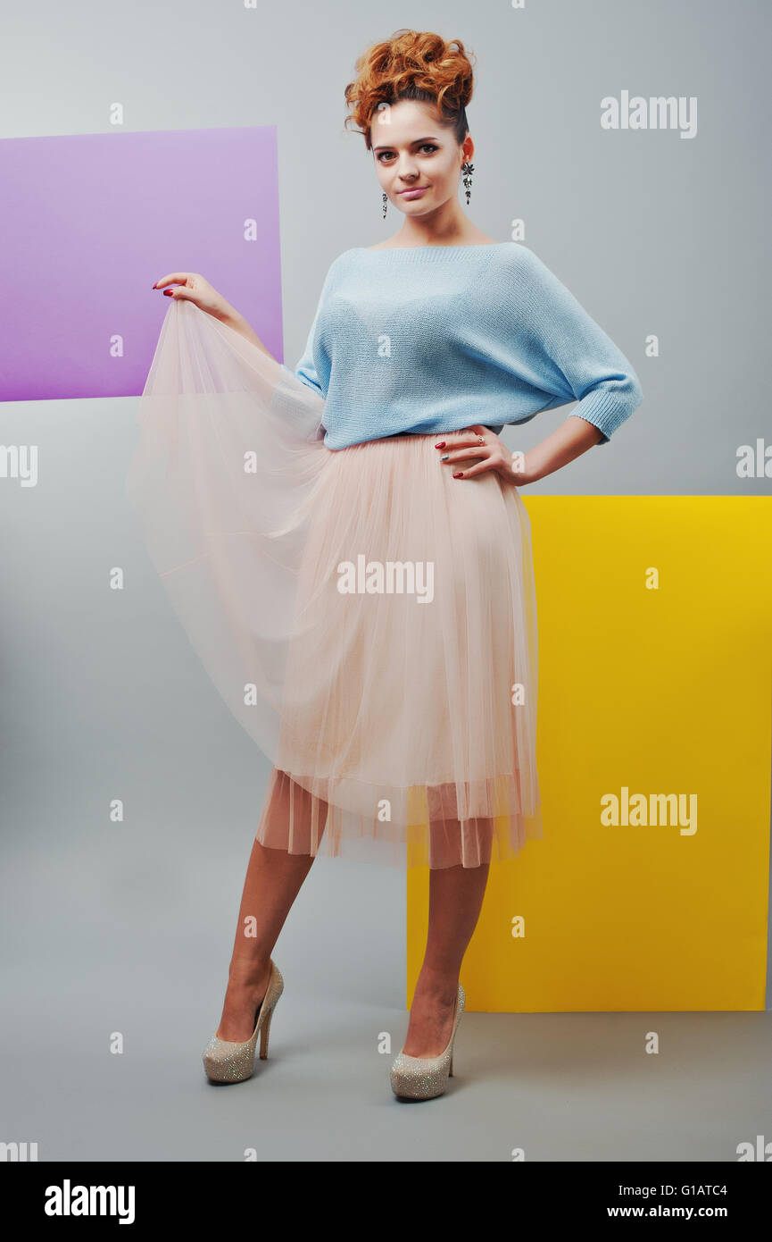 Full length studio portrait of young girl near art colored blanks Stock ...
