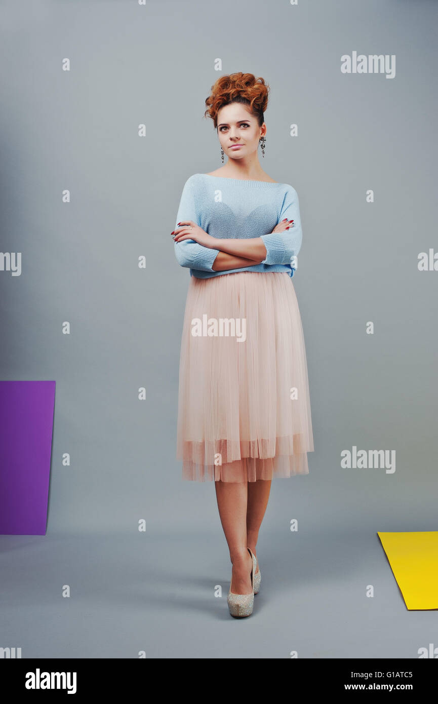 Full length studio portrait of young girl near art colored blanks Stock ...