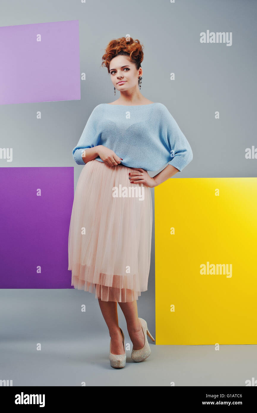 Full length studio portrait of young girl near art colored blanks Stock ...