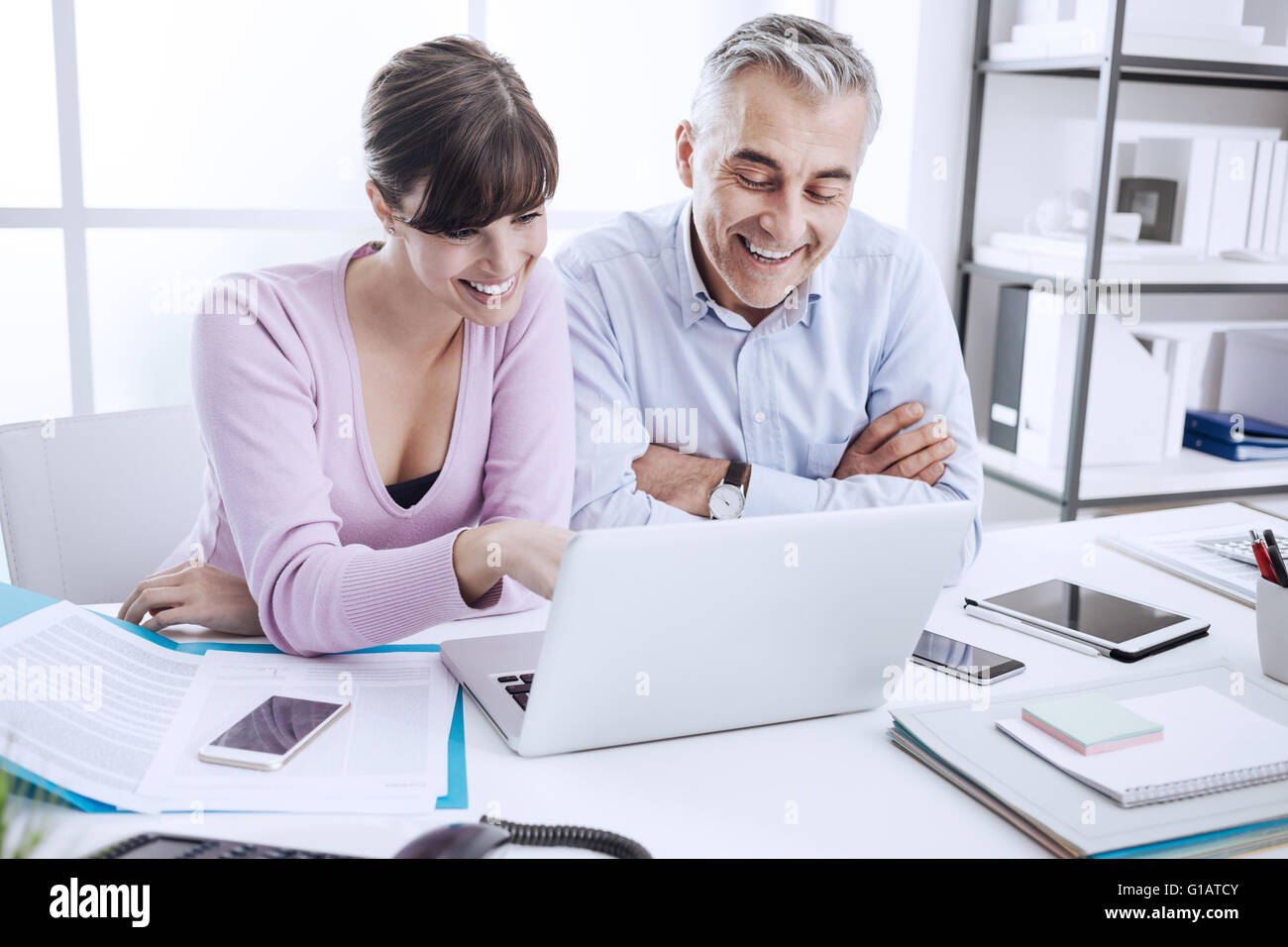 Woman watching man work hi-res stock photography and images - Alamy