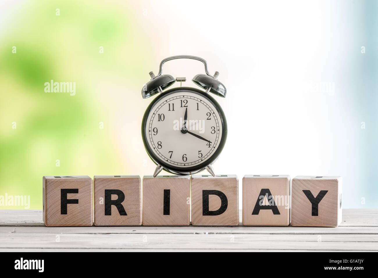 Friday sign with wooden blocks and a classic clock Stock Photo - Alamy