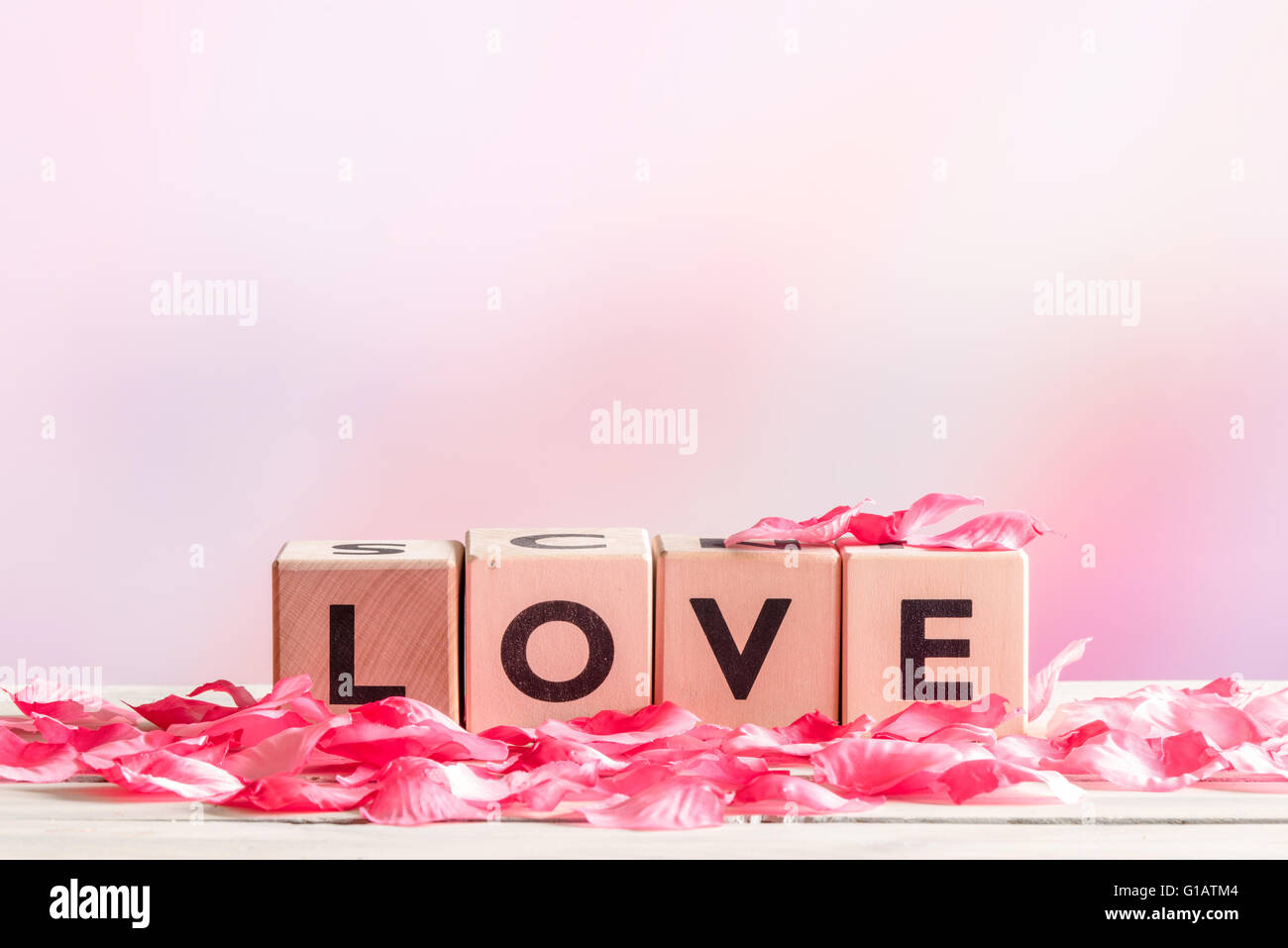 Love sign made of wood with rose leaves Stock Photo - Alamy