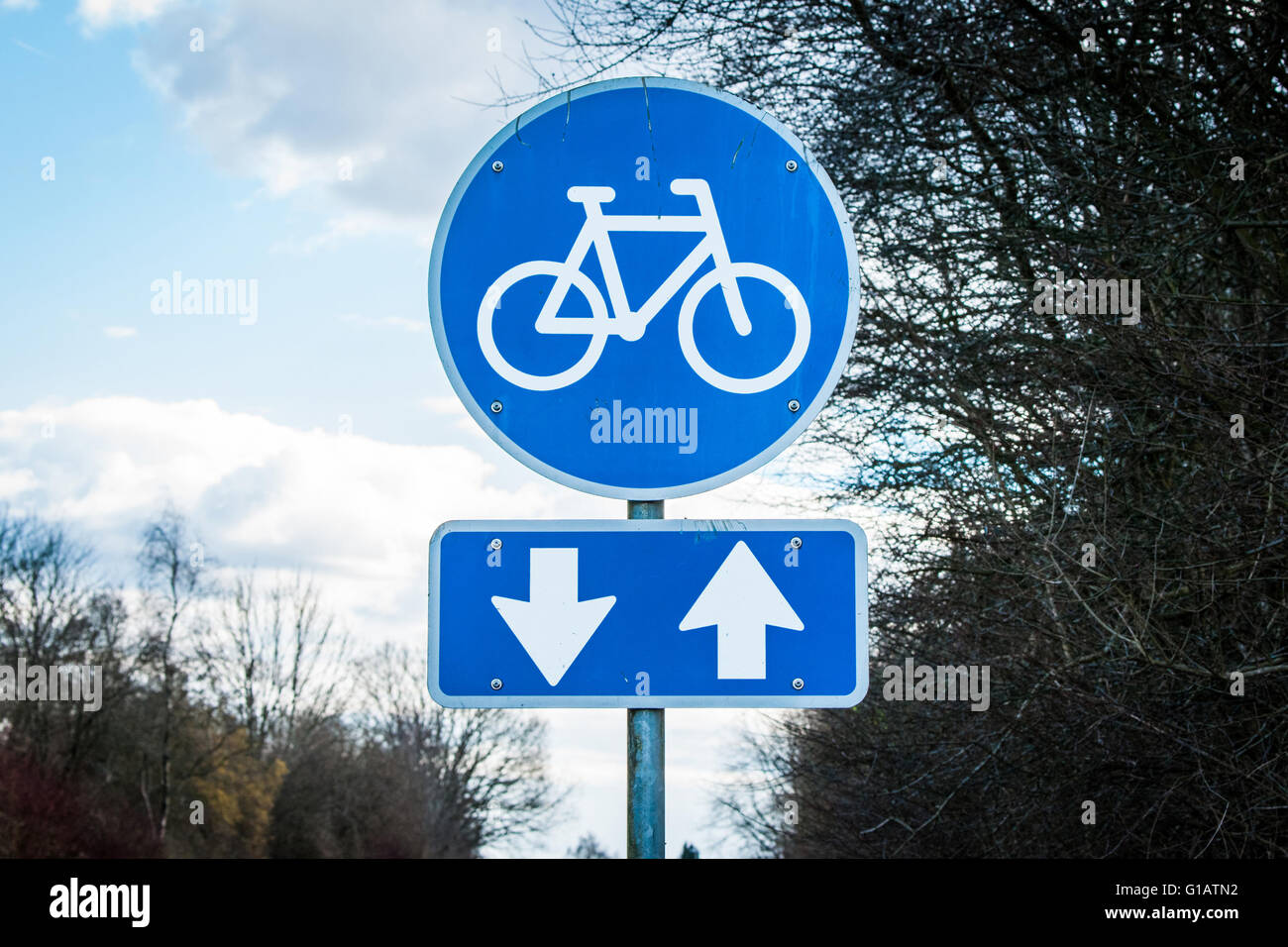 Bike sign in blue color with two arrows Stock Photo - Alamy