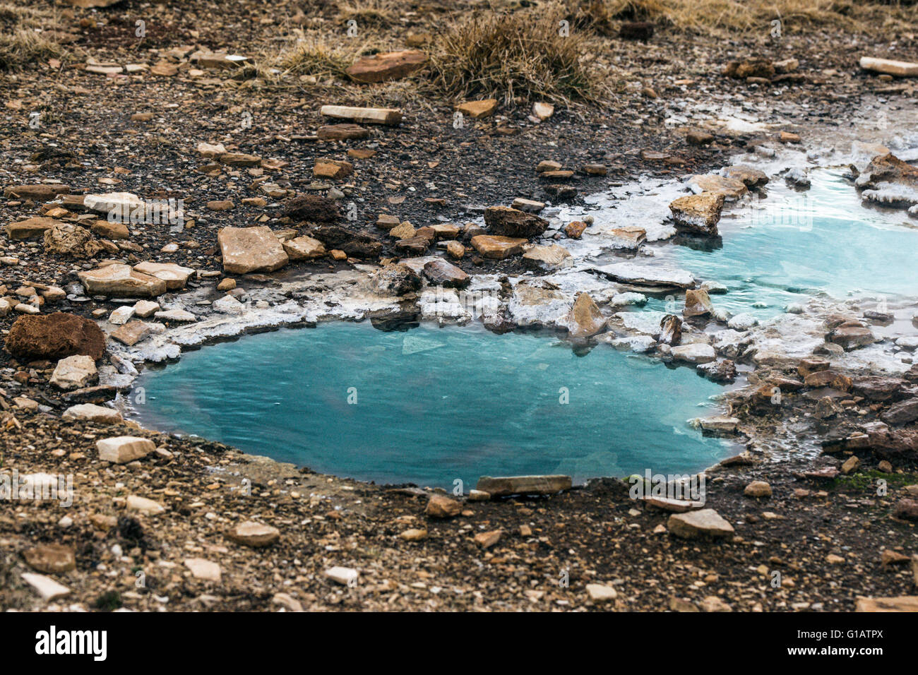 Geothermal water hole in Iceland with blue water Stock Photo - Alamy