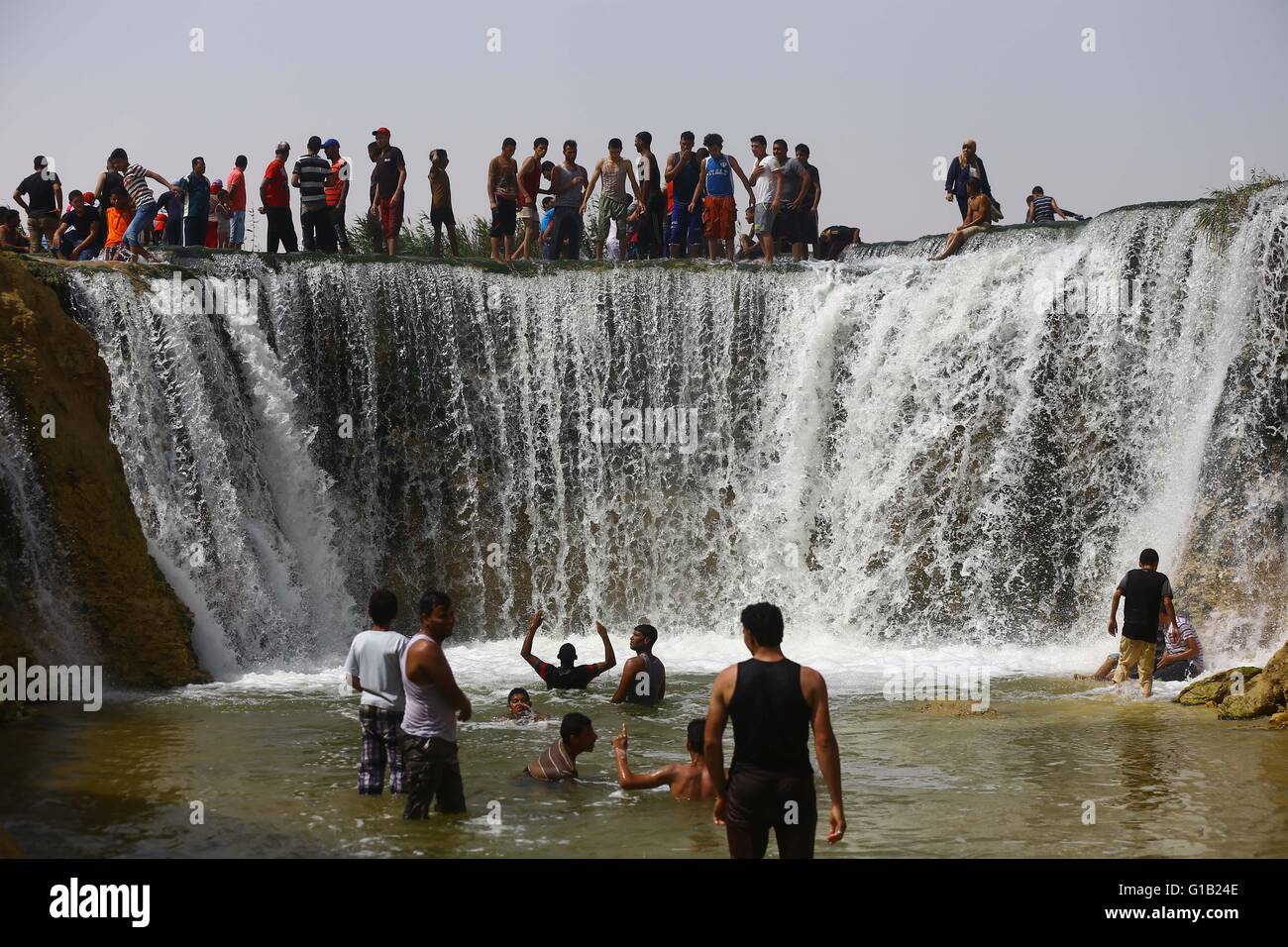 Fayoum, Egypt. 10th May, 2016. People amuse at a waterfall in Wadi El ...