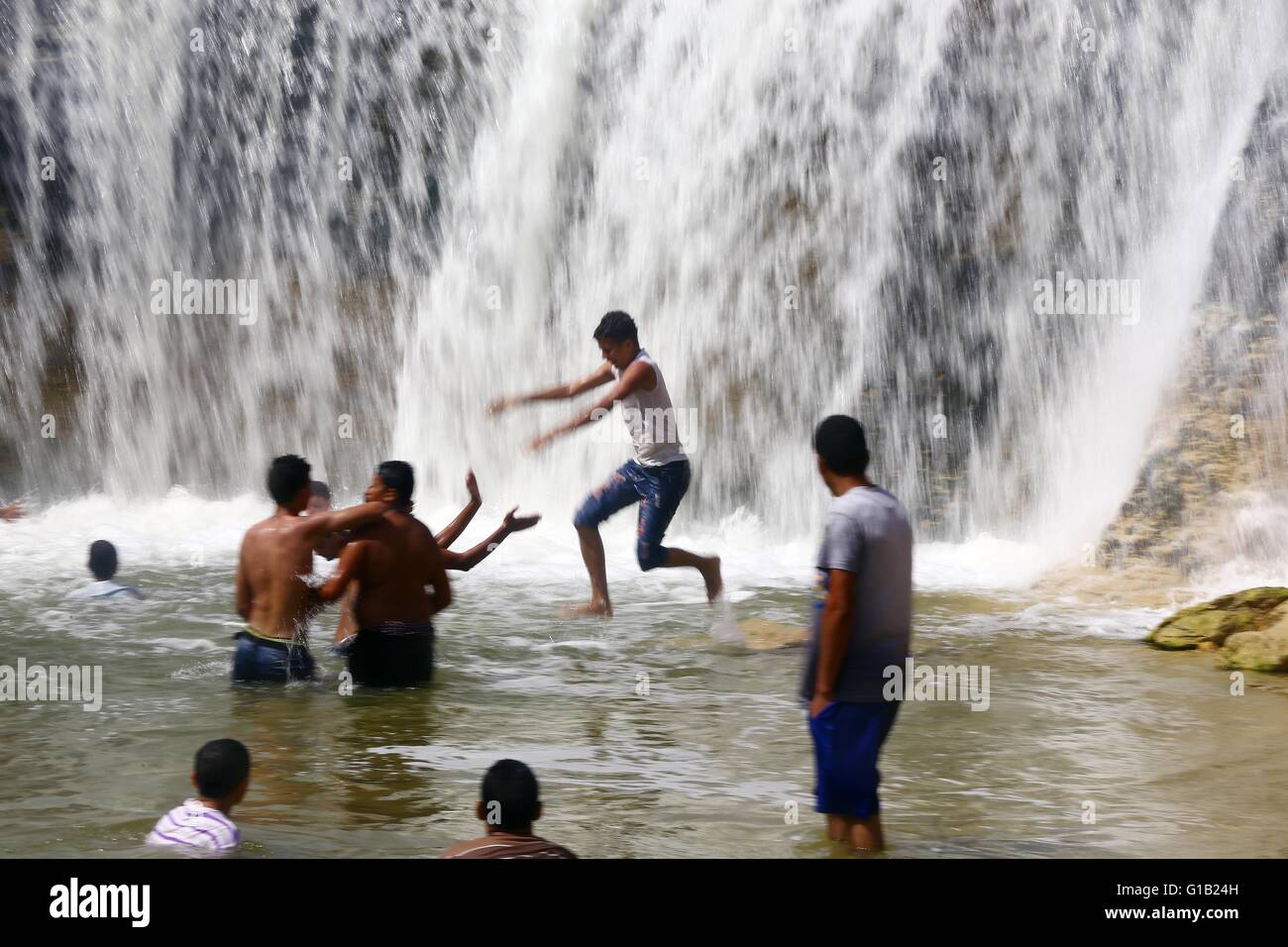 Fayoum, Egypt. 10th May, 2016. People amuse at a waterfall in Wadi El ...