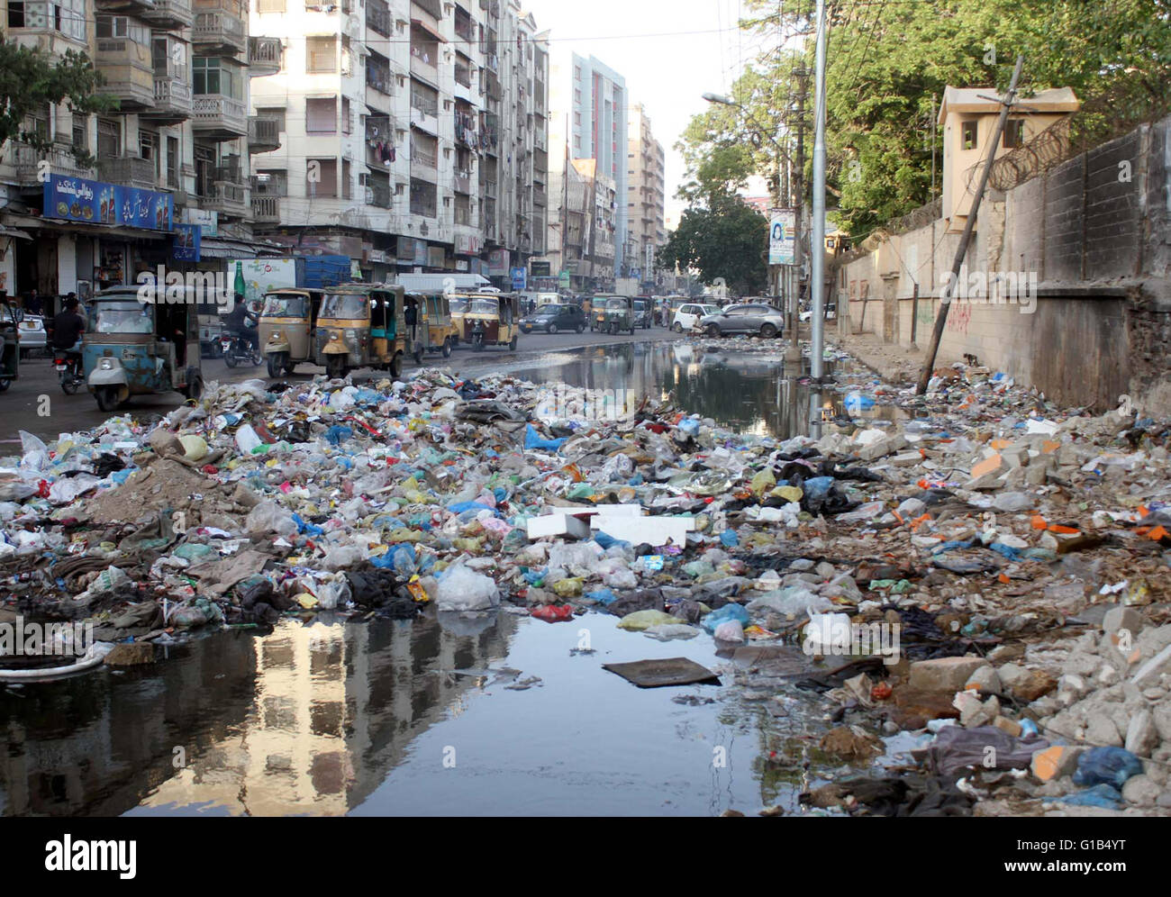 Huge heap of garbage and flowing gutter water showing negligence of KMC ...