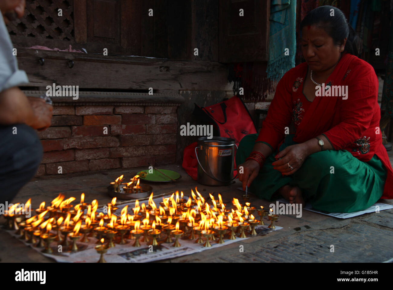 Devotees offer prayers with lighting butter lamps during the chariot ...