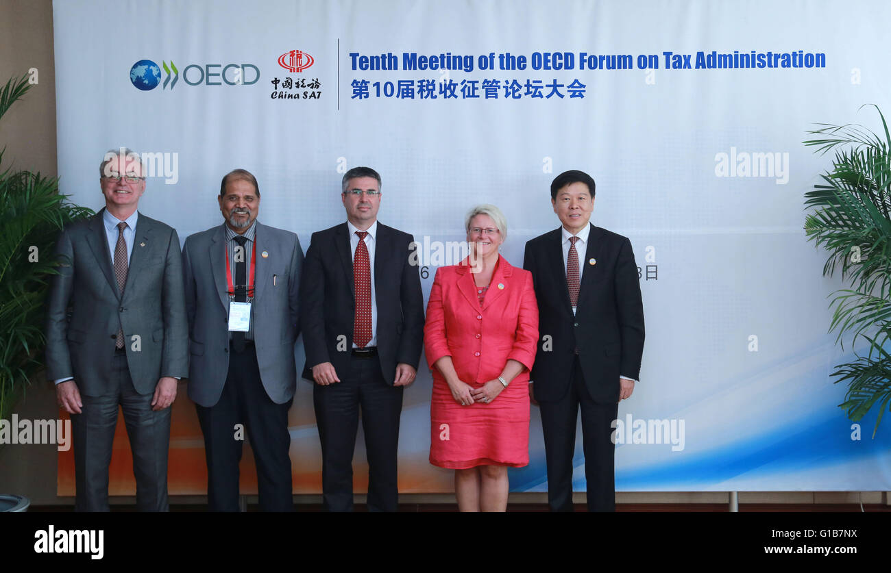 Beijing, China. 12th May, 2016. Wang Jun (1st R), administrator of ...