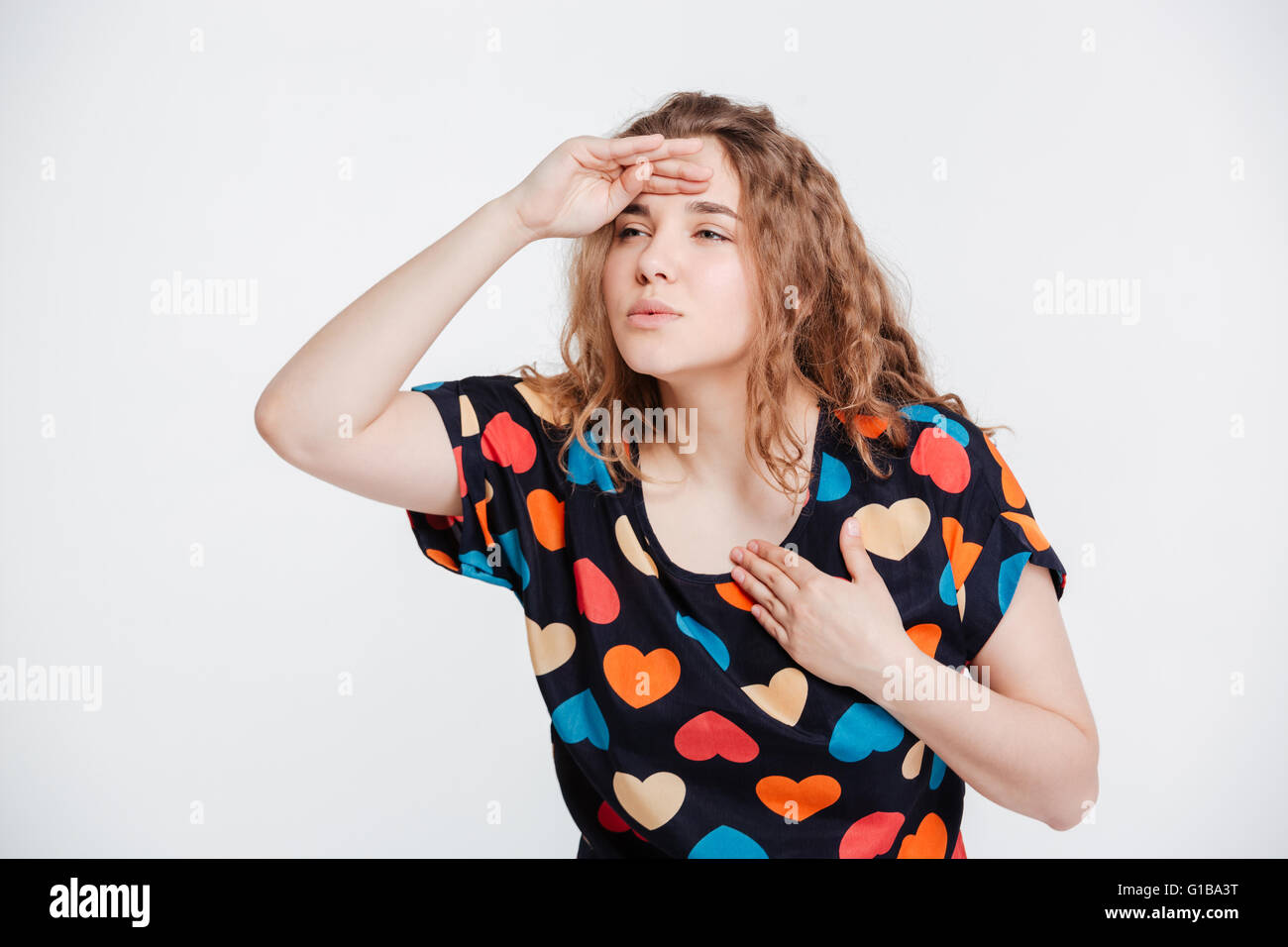 Woman looking into the distance isolated on a white background Stock ...