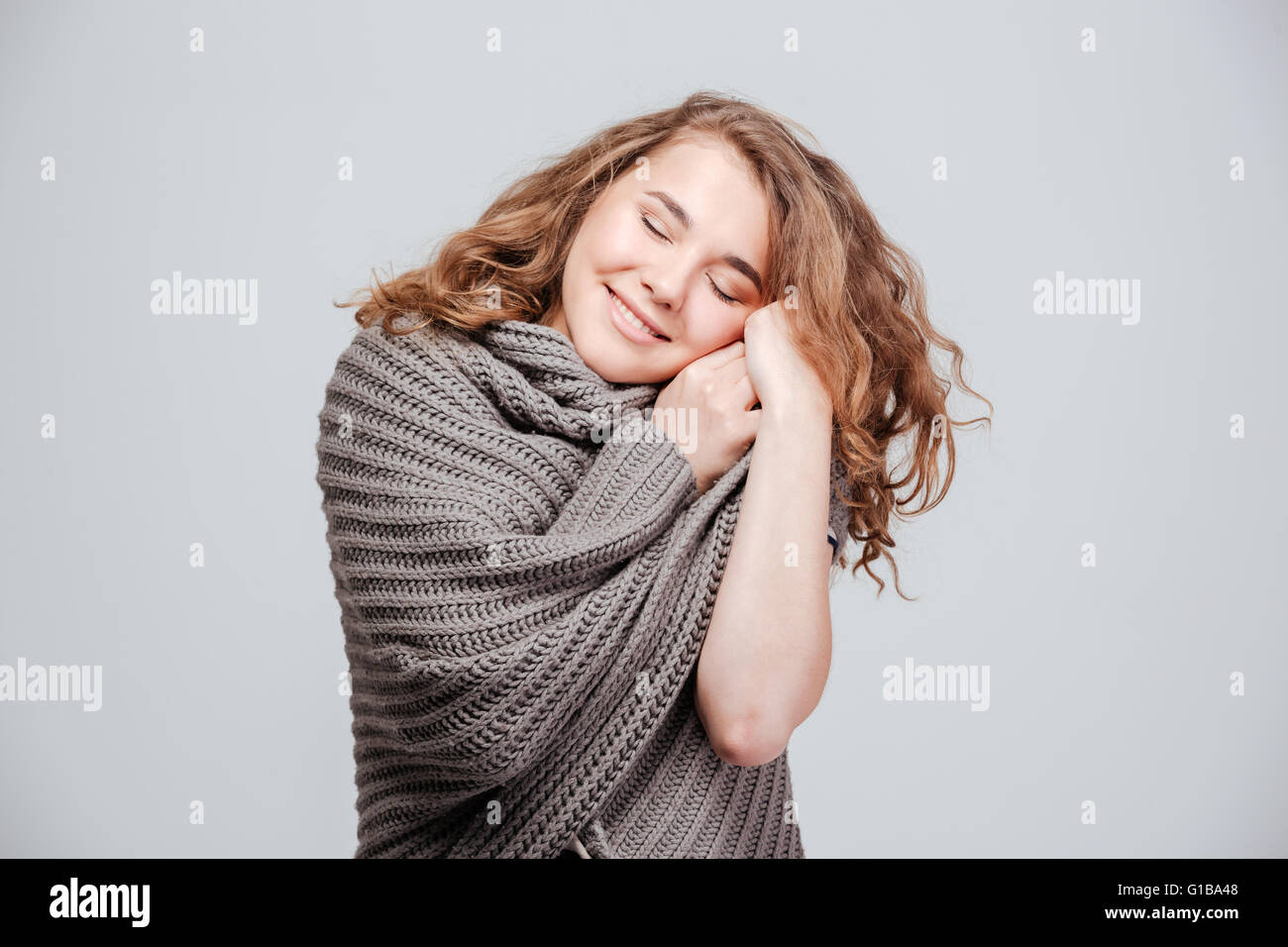 Pretty woman relaxing isolated on a white background Stock Photo - Alamy